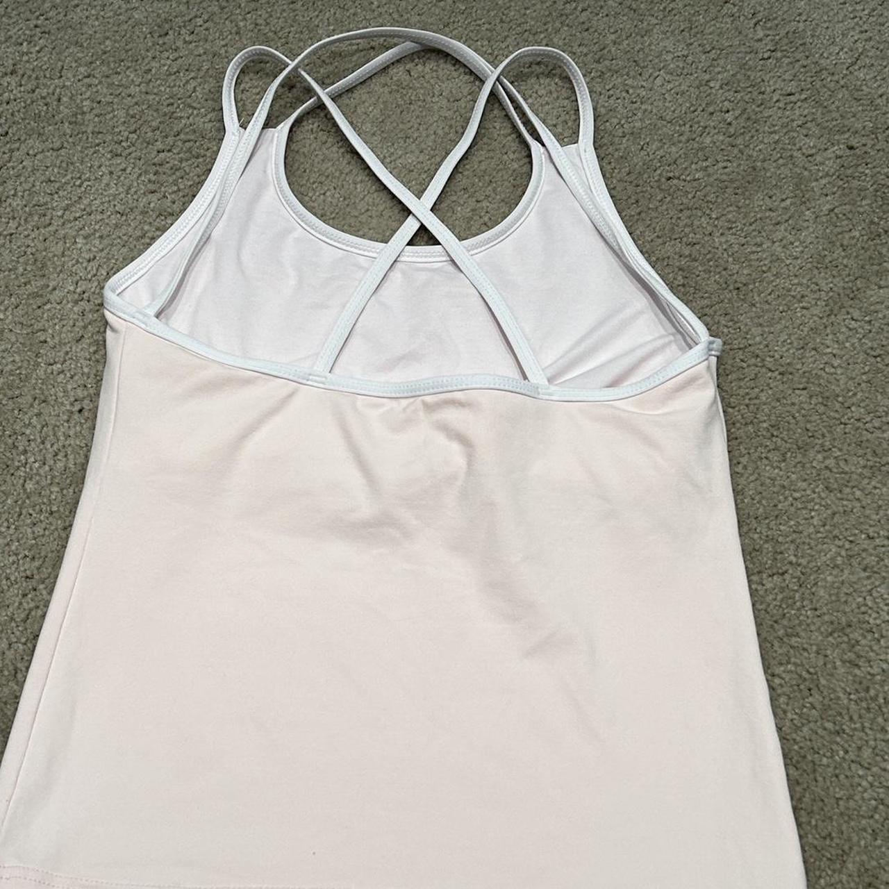 Light Pink ‘running bare’ cross over singlet top... - Depop
