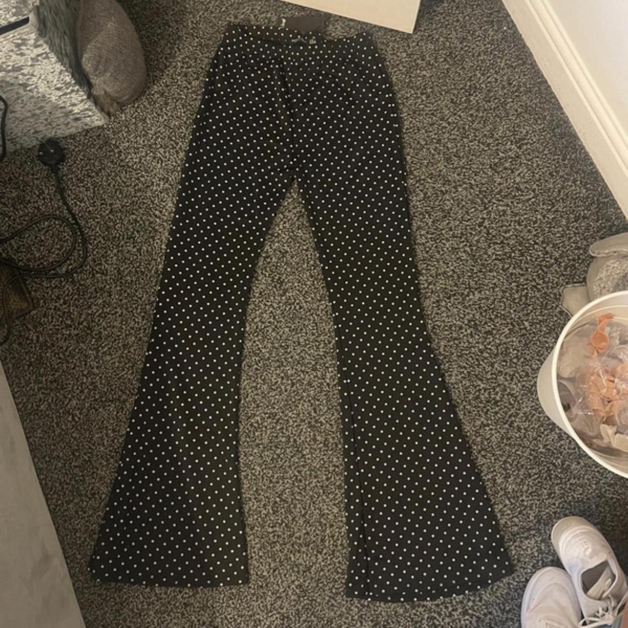 Flared spotted trousers, leggings material, never... - Depop
