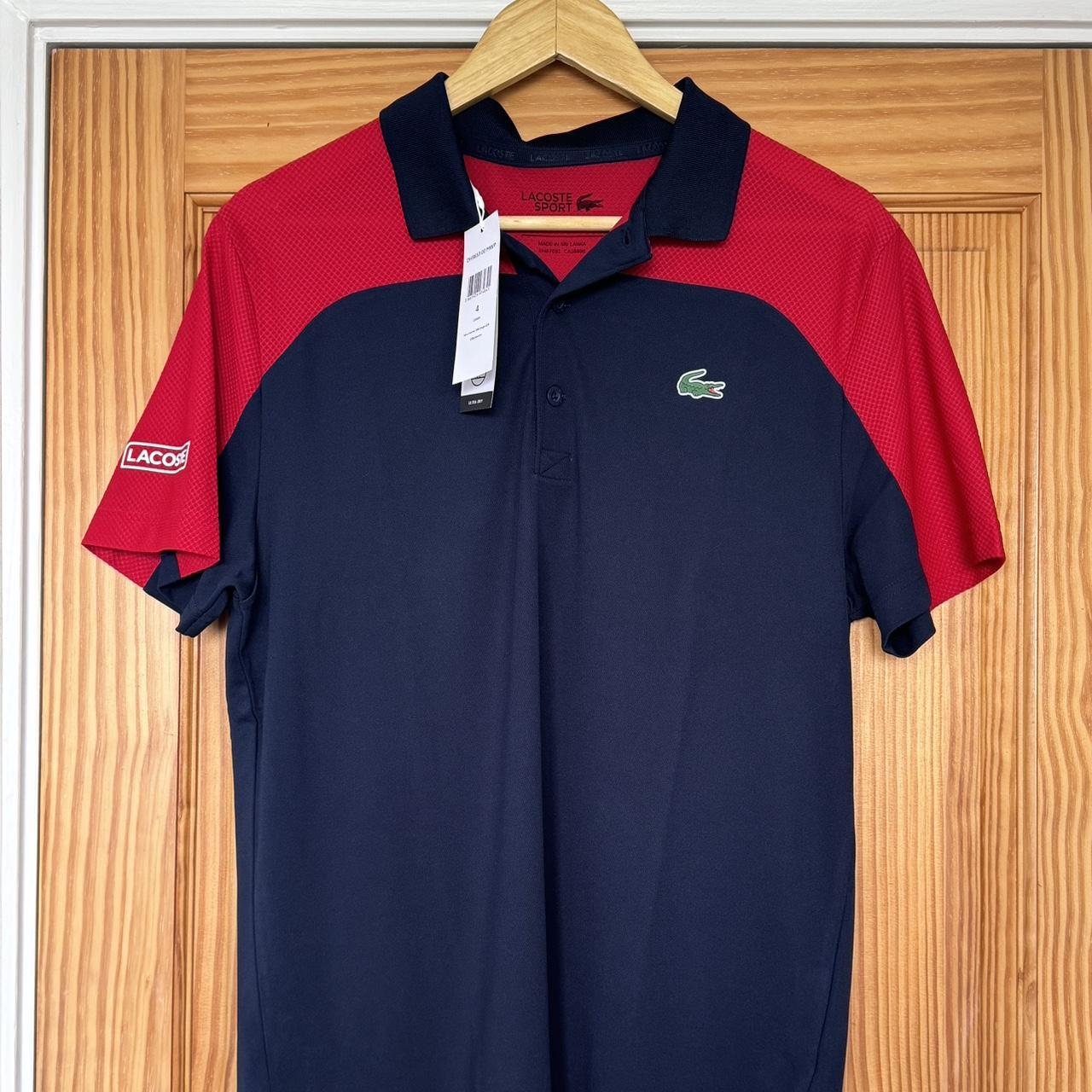 Lacoste navy and red polo shirt. Size M. New with tags - Depop