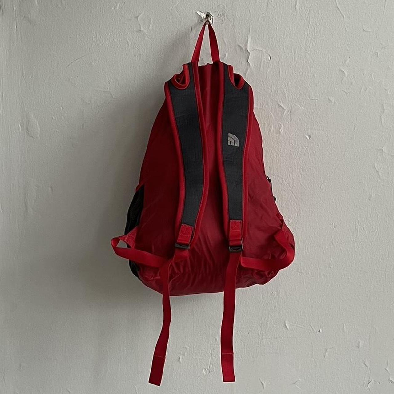 Very cool 2000s red nylon North Face backpack in... - Depop