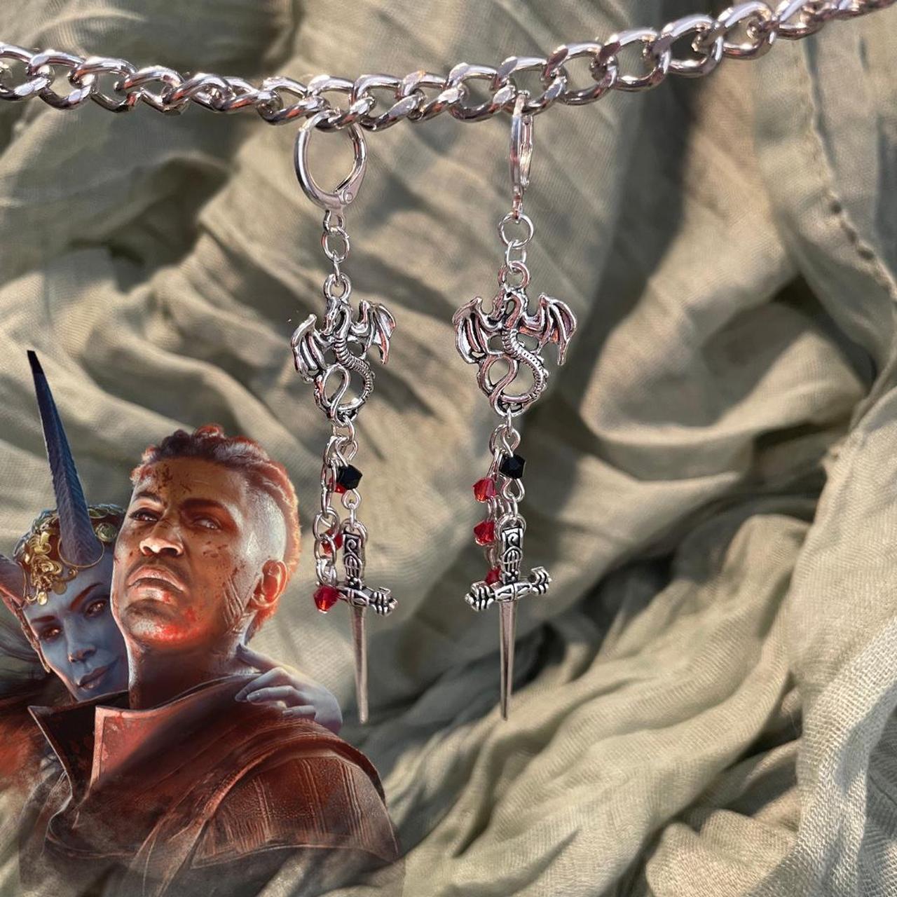 THE BLADE OF FRONTIERS - bold dangle earrings... | Depop