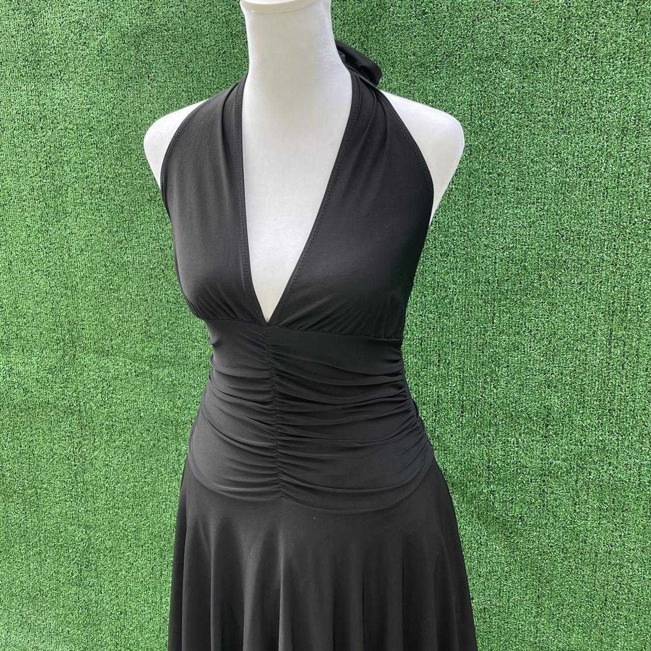 The cutest freaking asymmetrical black halter top... - Depop