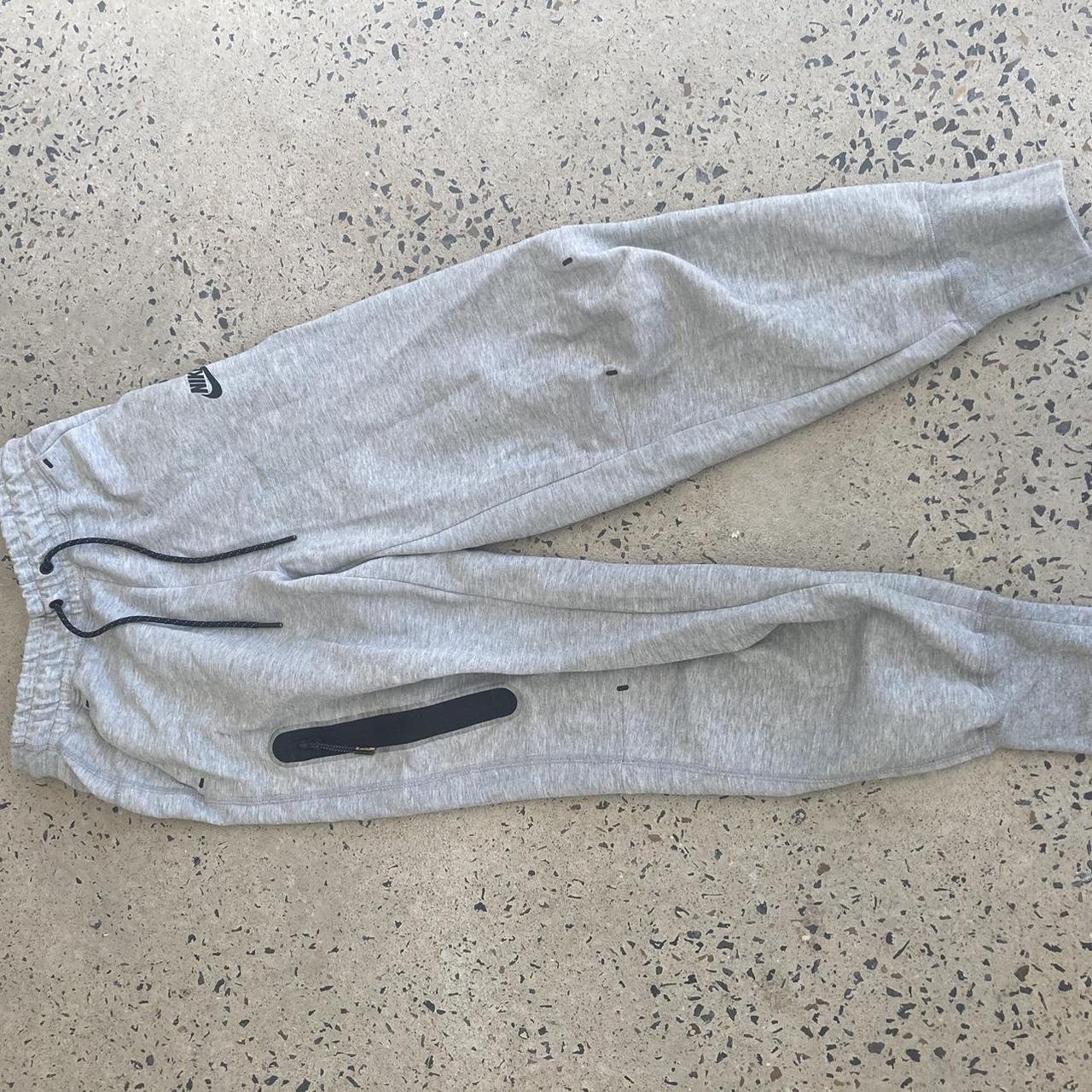 xsmall womens grey nike tech trackies. worn quite a... - Depop