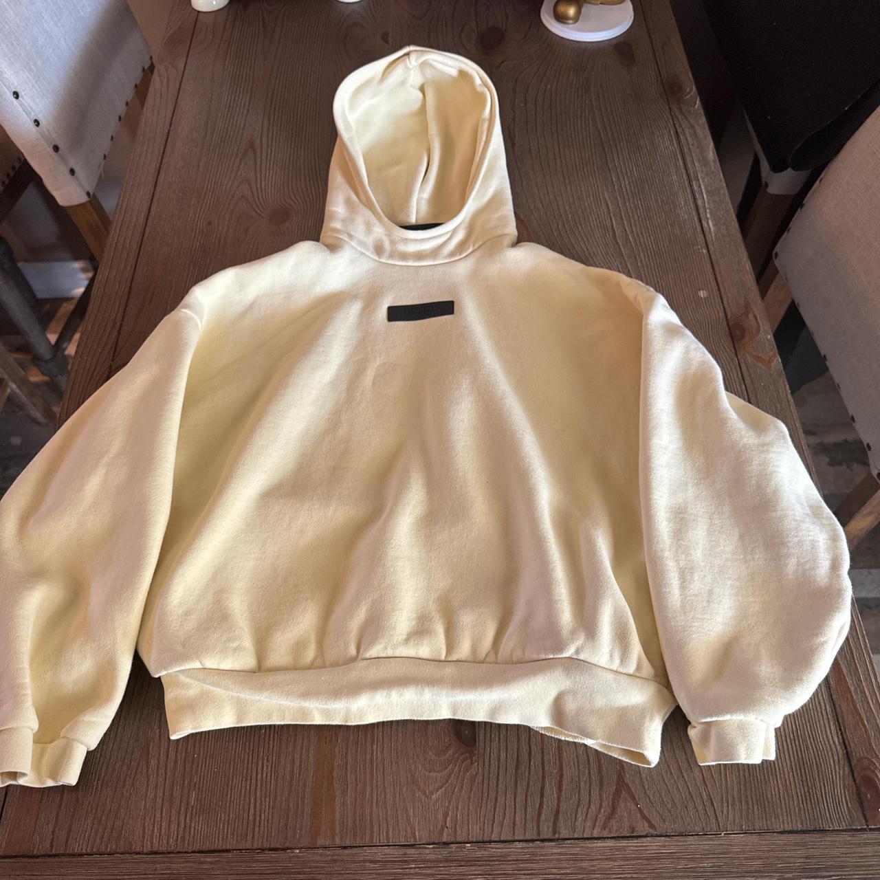 light yellow essentials hoodie worn a few times size... | Depop