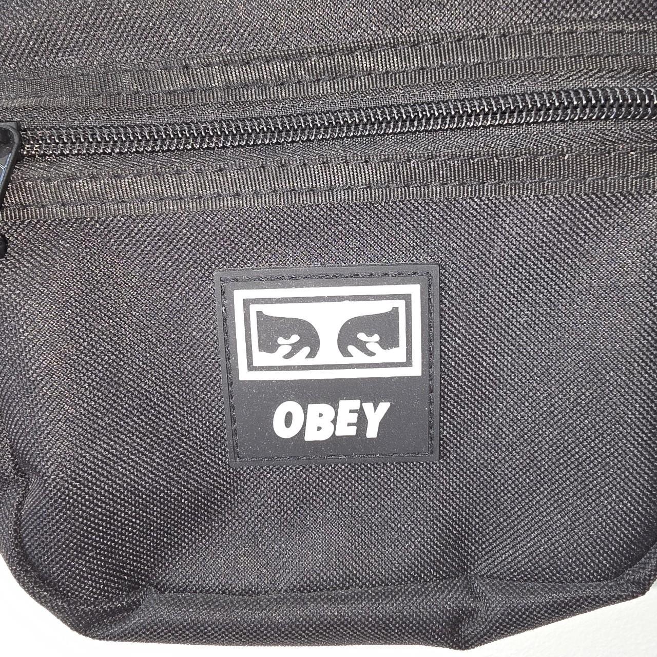 small black obey bag, lots of pockets #obey... - Depop