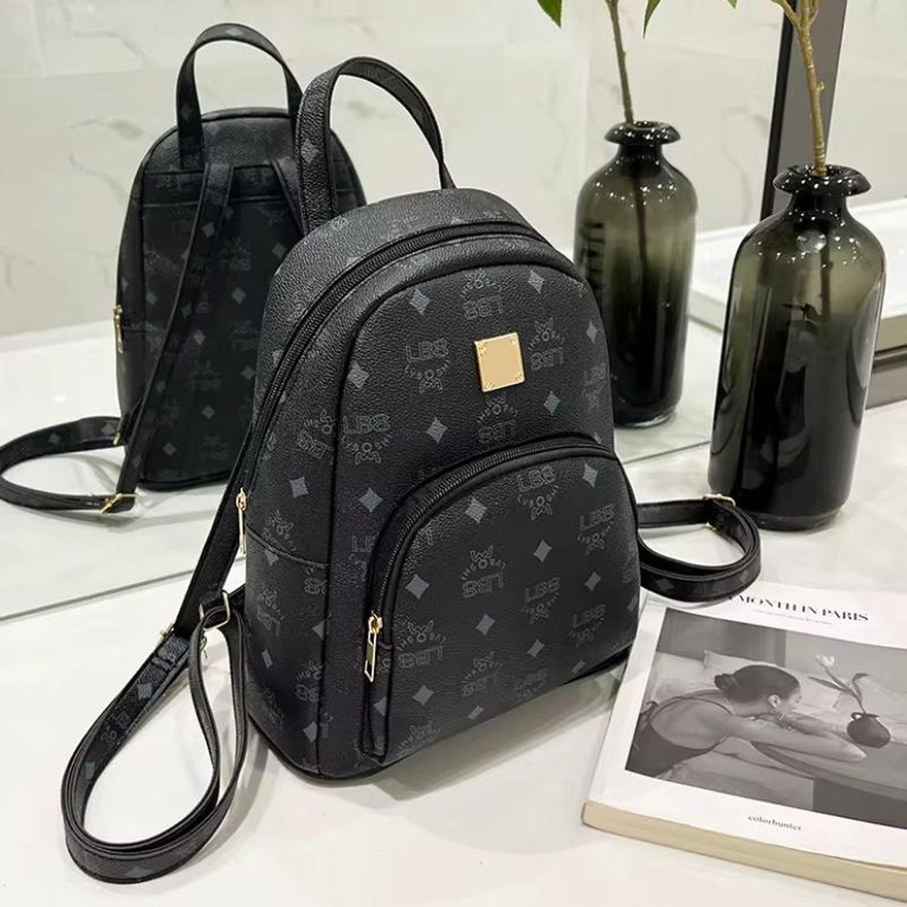 Mini Black and gold MCM backpack for women custom... | Depop