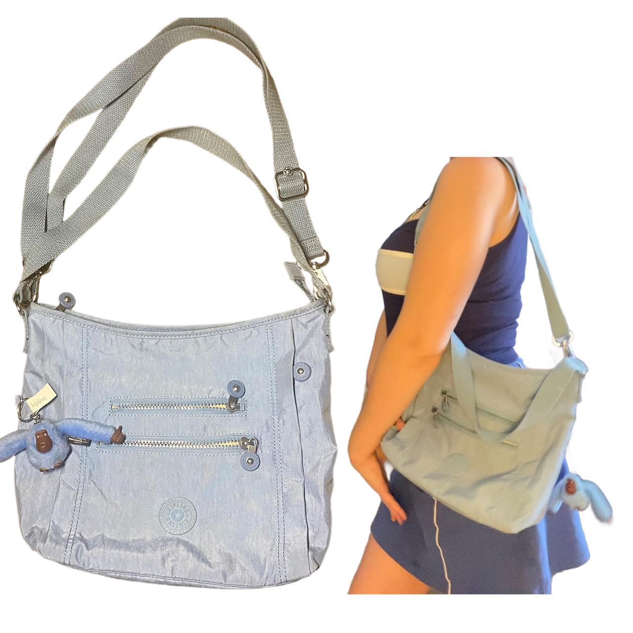 Kipling Live.Light baby blue bag, features plenty of... - Depop