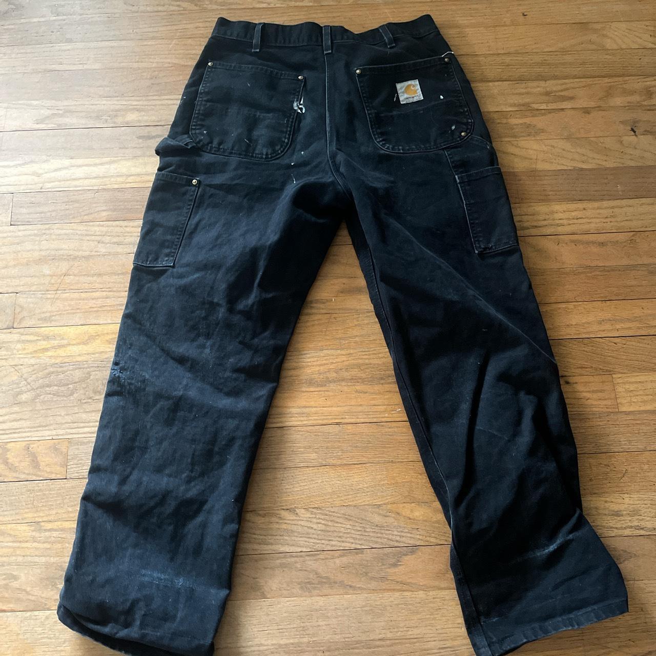 Black Carhartt workwear pants. White paint stains... - Depop