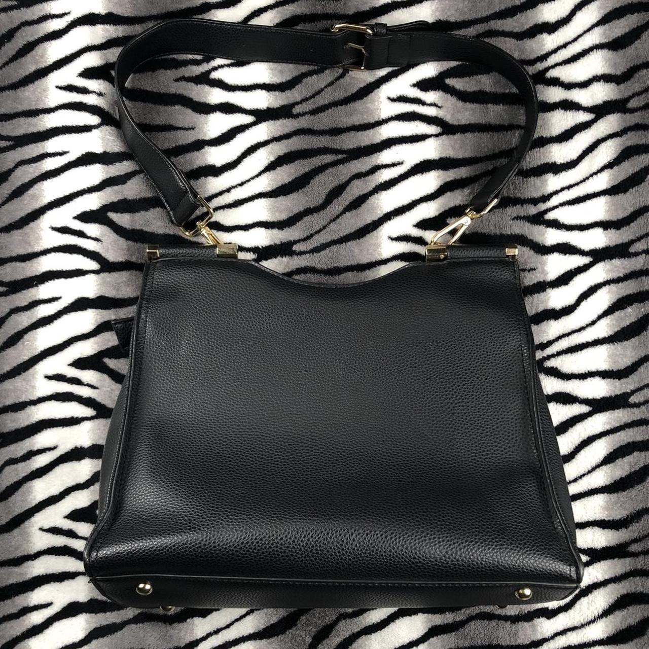 - Bebe Black Handbag •Gorgeous faux leather... - Depop