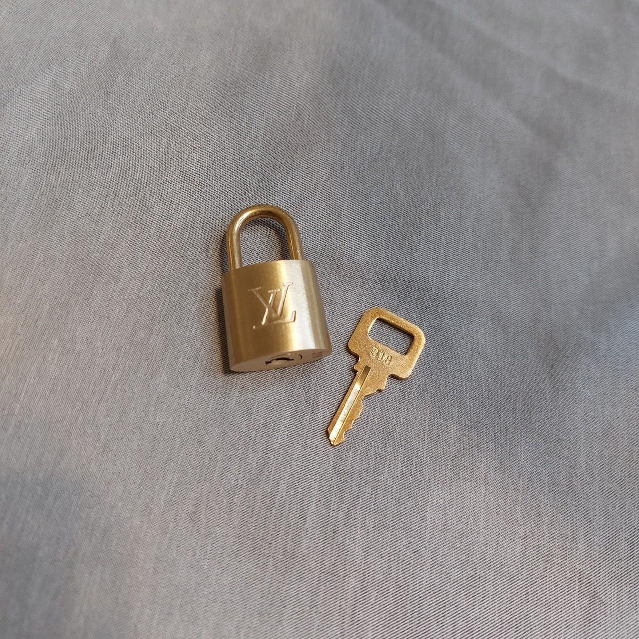 Authentic Louis Vuitton bag lock Gold / brass finish... - Depop