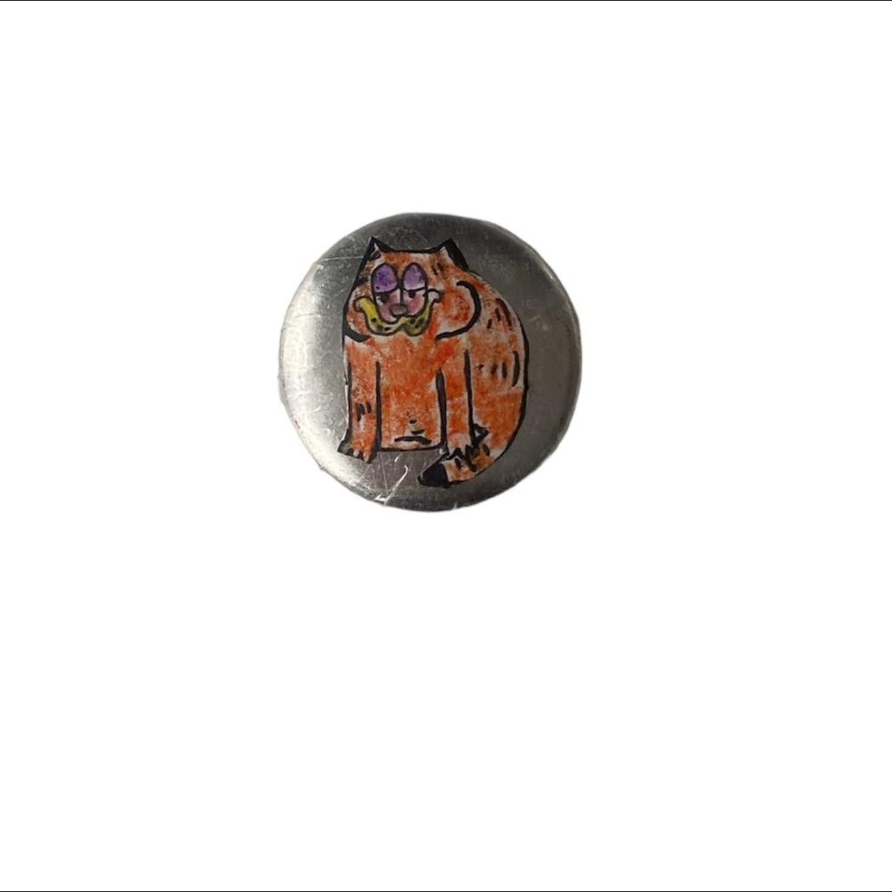 high garfield button plastic coated at the... - Depop