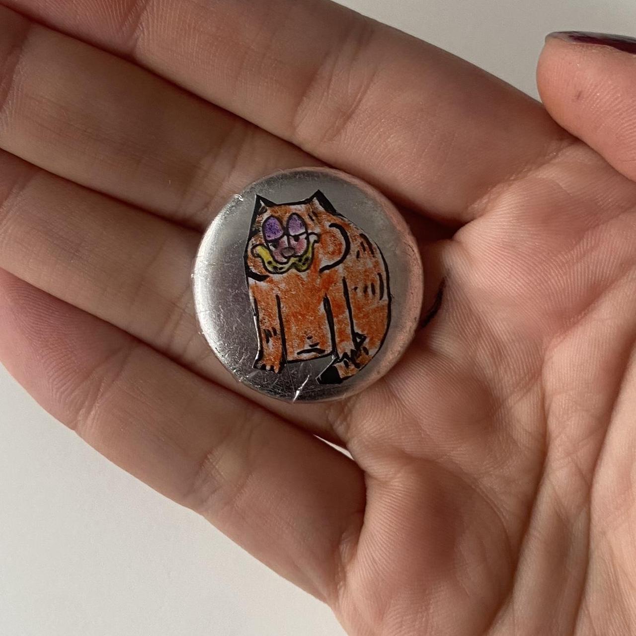 high garfield button plastic coated at the... - Depop