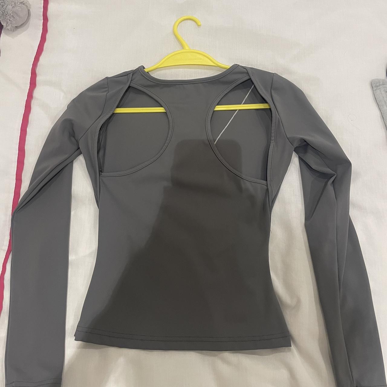 PLT sport cut out back gym top. No tag but never... - Depop