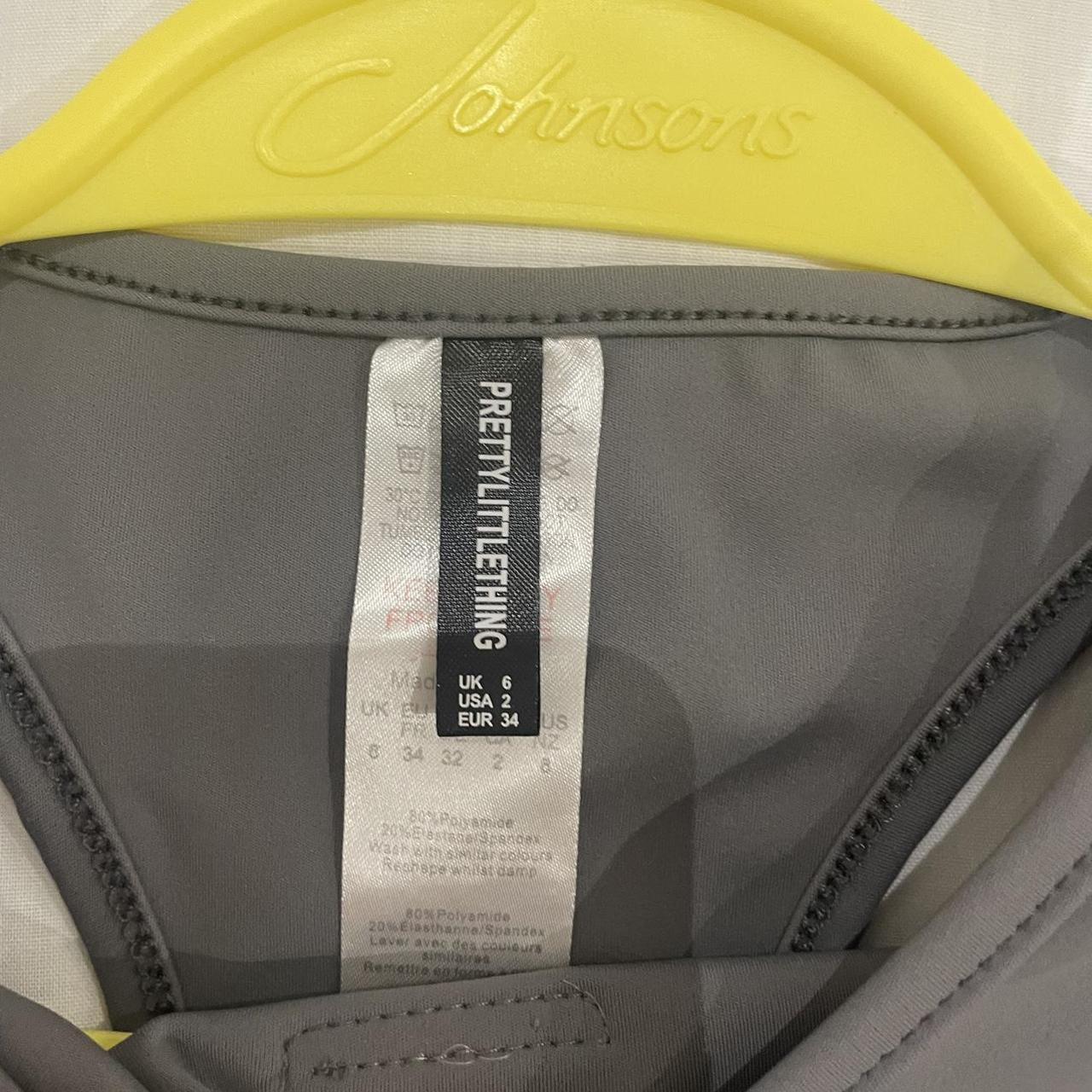 PLT sport cut out back gym top. No tag but never... - Depop