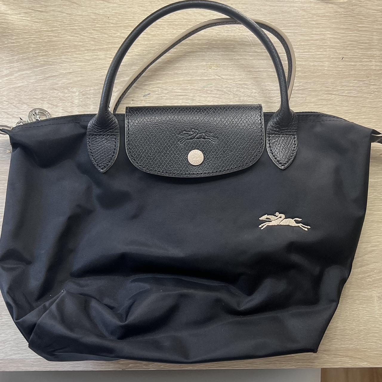 Small black longchamp bag with white logo. Slightly... - Depop