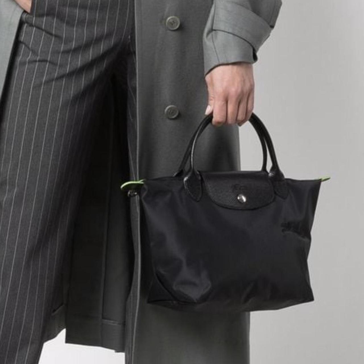 Small black longchamp bag with white logo. Slightly... - Depop