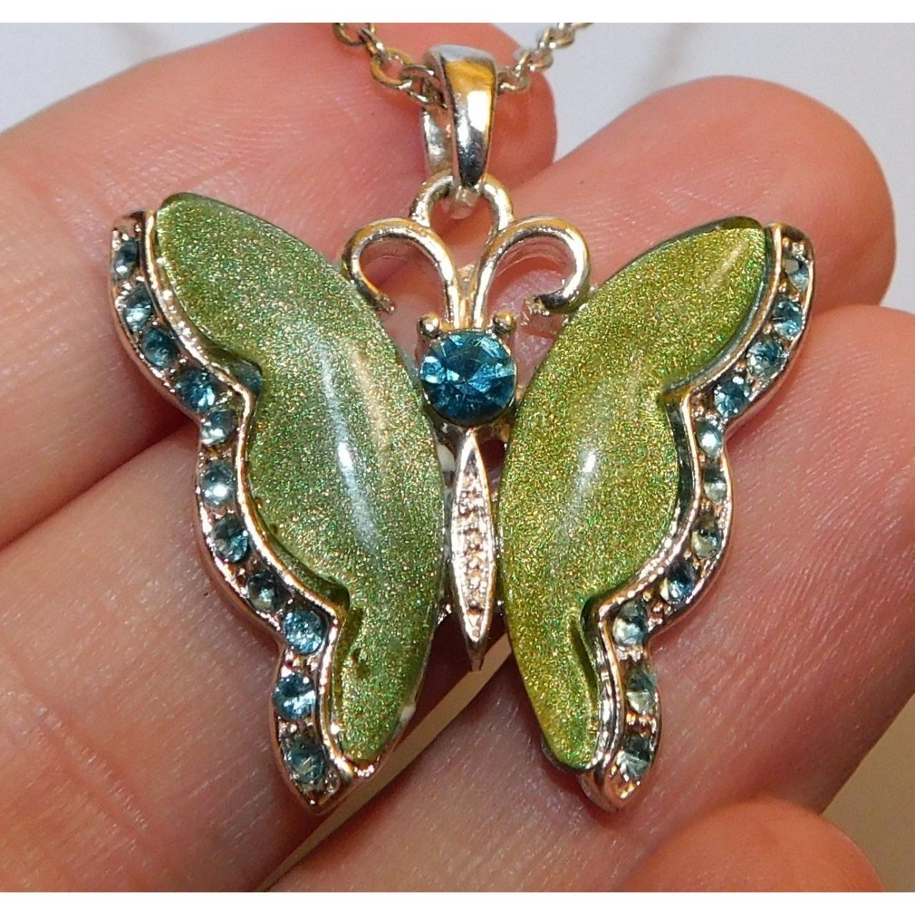 Green butterfly necklace. Roughly 16 inches with a... - Depop