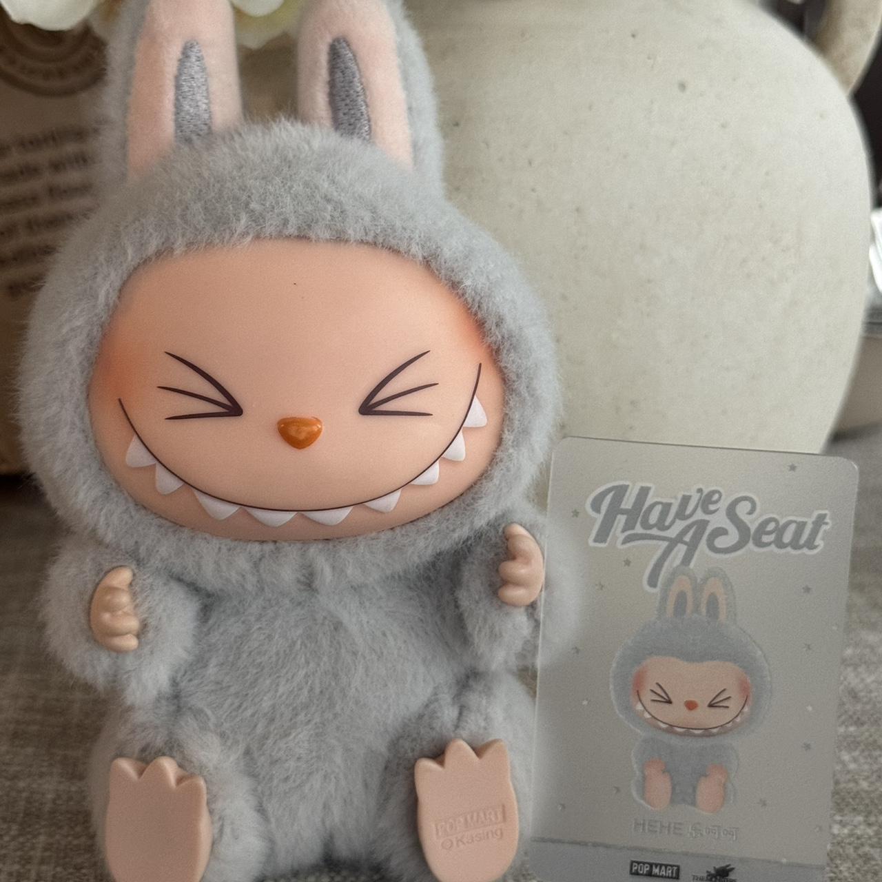 have a seat labubu hehe on my page right now. tiny... | Depop