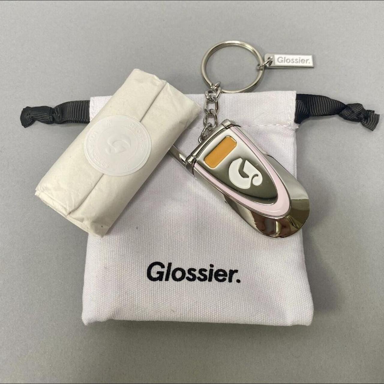 glossier phone keychain in its original packaging.... - Depop