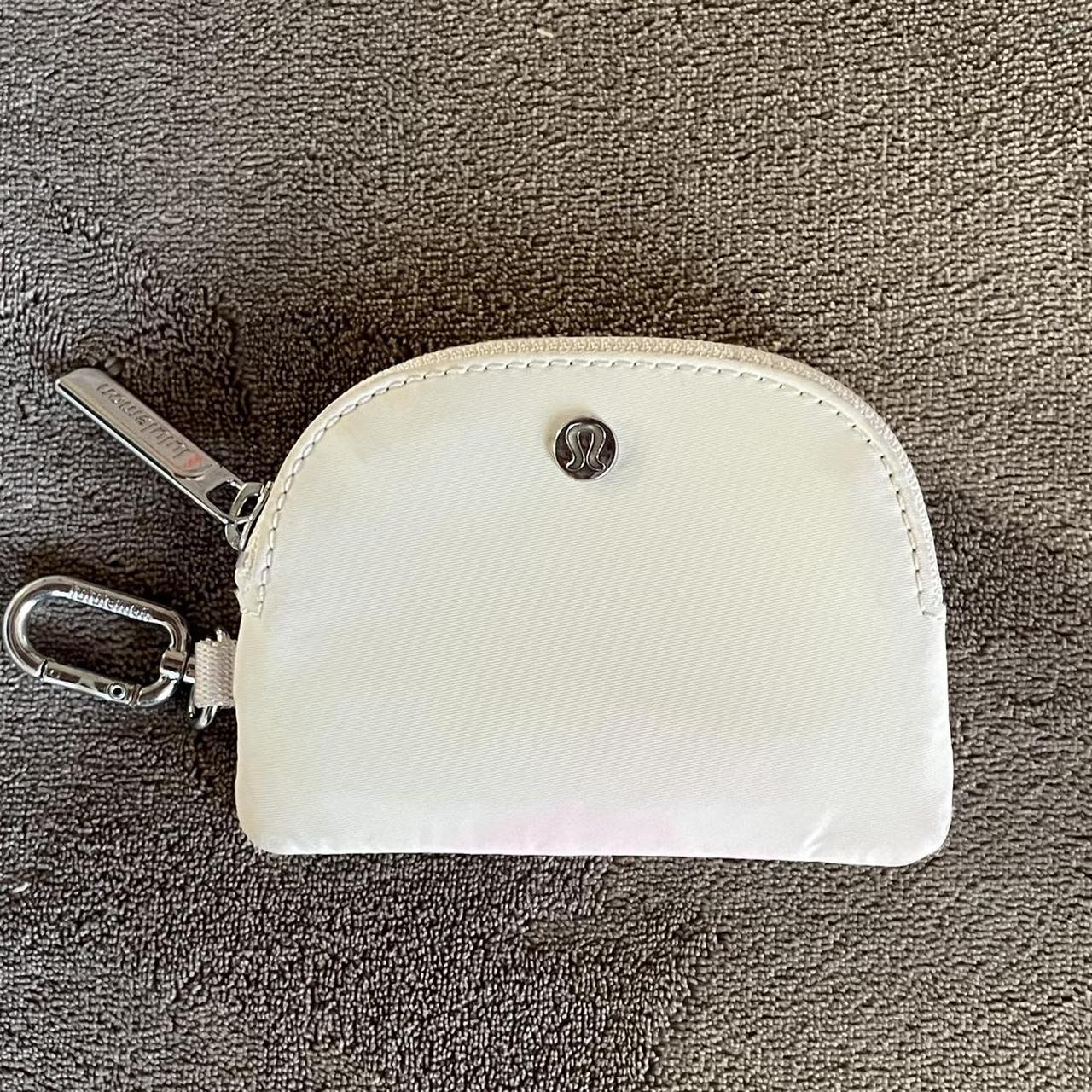 Lululemon white wallet with light pink stain on back - Depop