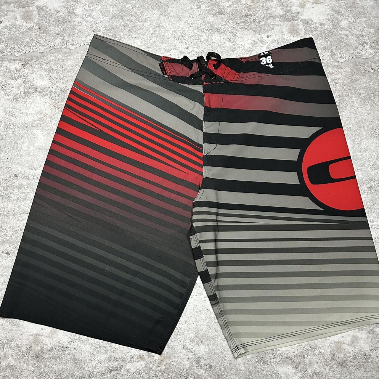 Oakley black and red board shorts size 36 men’s... | Depop