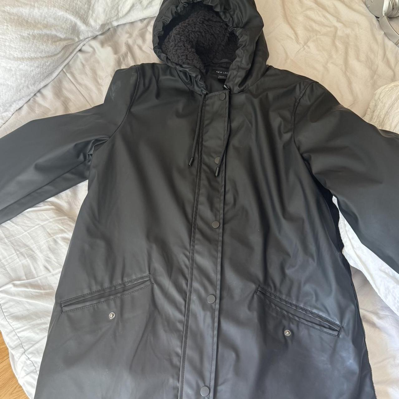 Black waterproof coat with a hood, featuring pockets... - Depop