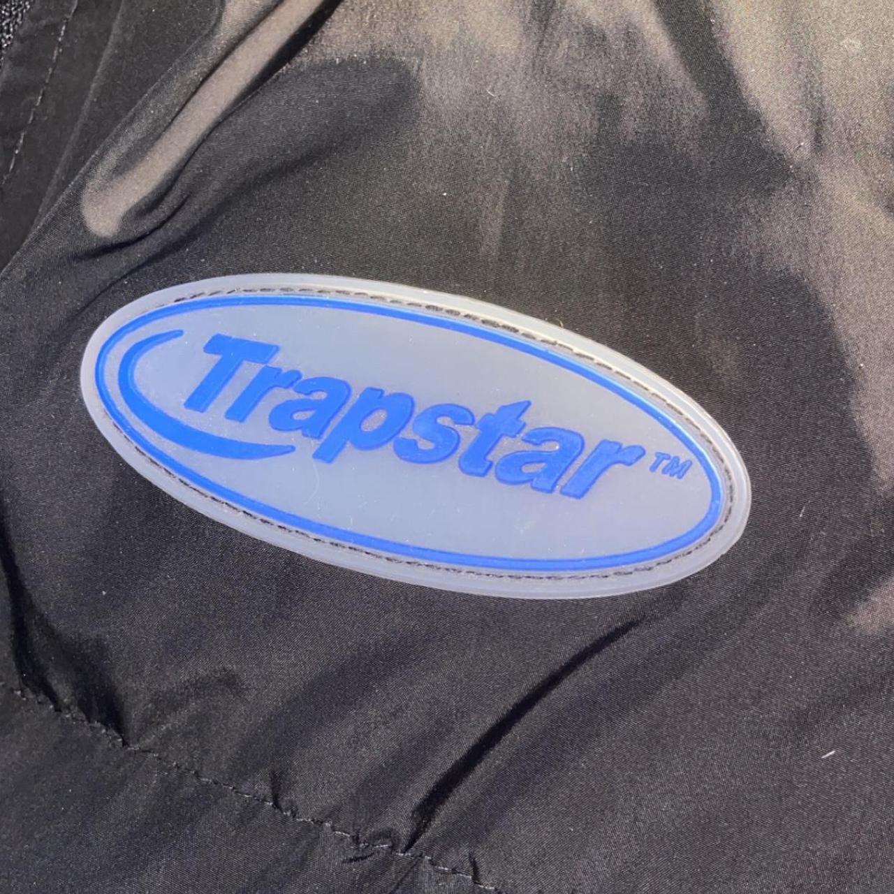 Black and blue trapstar hyperdrive puffer L with rip... - Depop