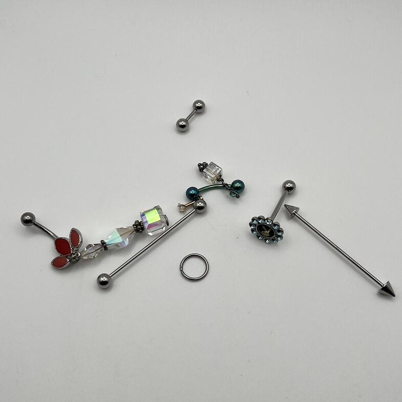 Body jewelry set. Featuring Tongue, belly button,... - Depop
