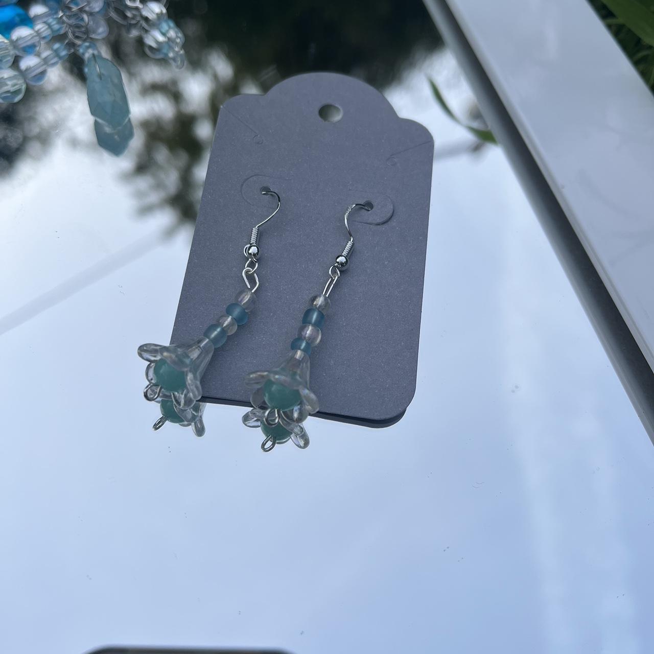 Simple aquamarine flower Lilly drop earrings :) sea... - Depop
