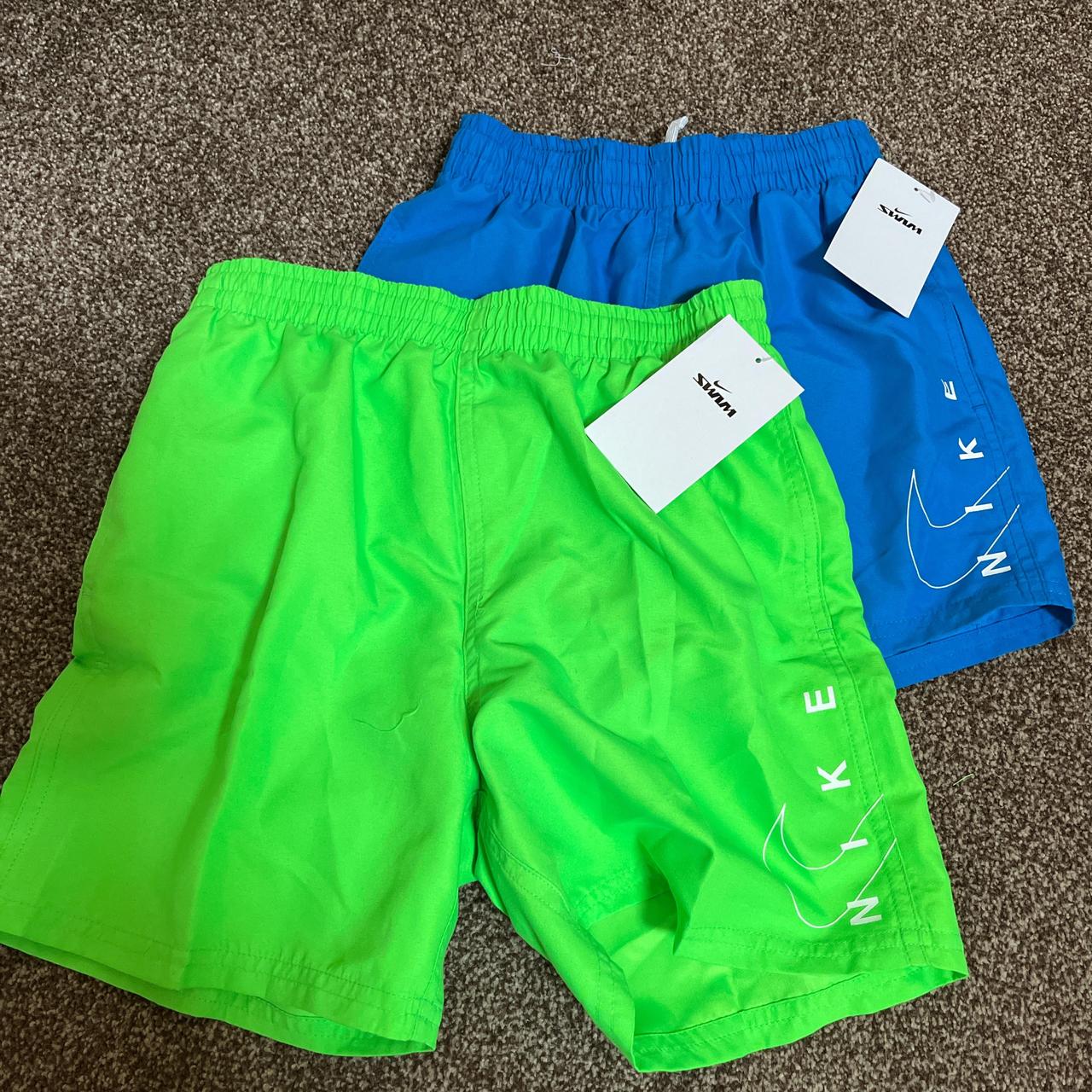 Nike neon green and blue kids swim shorts, bought by... | Depop