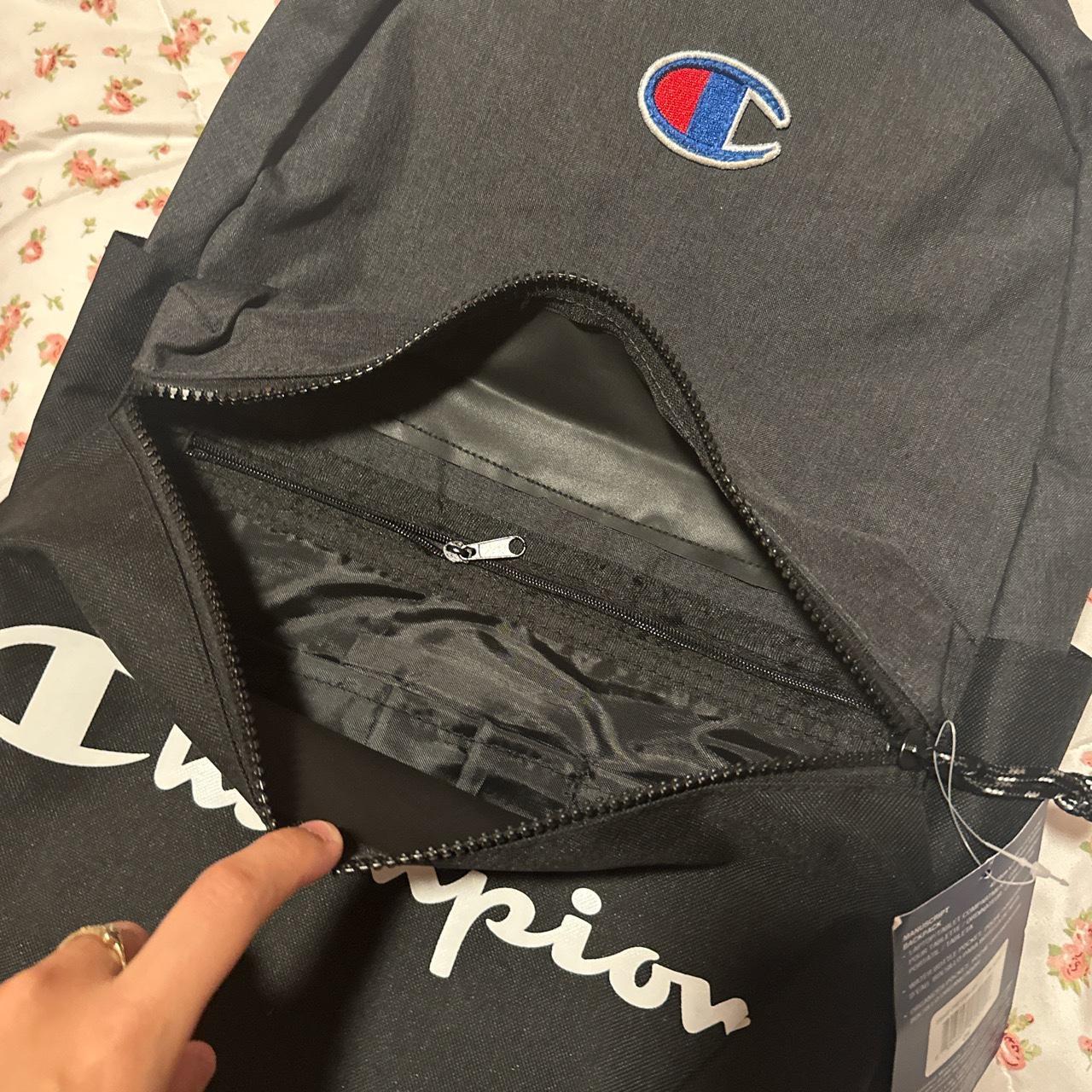 brand new black champion backpack has two main... - Depop