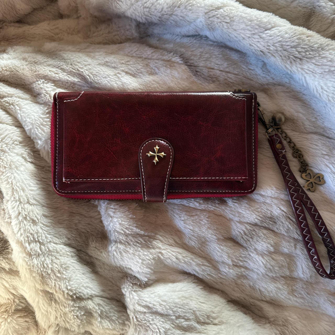 Burgundy leather wallet with hand strap and charms... - Depop