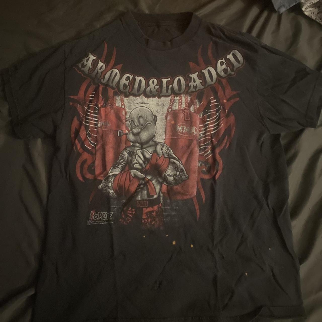 Armed and loaded graphic tee Small rips Wrinkles... - Depop
