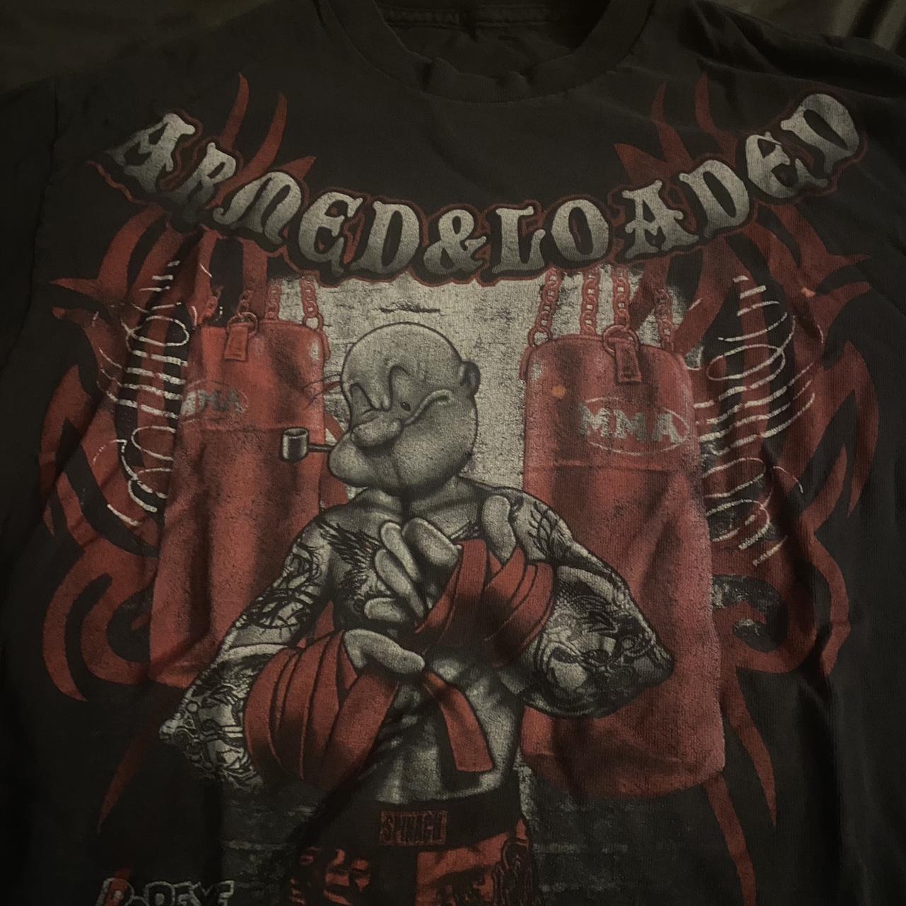 Armed and loaded graphic tee Small rips Wrinkles... - Depop
