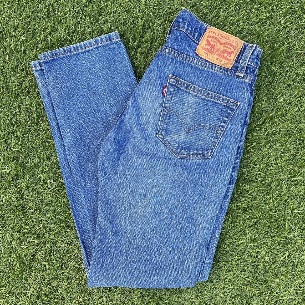 Levi’s 511 blue jeans with white paint wear on the... - Depop