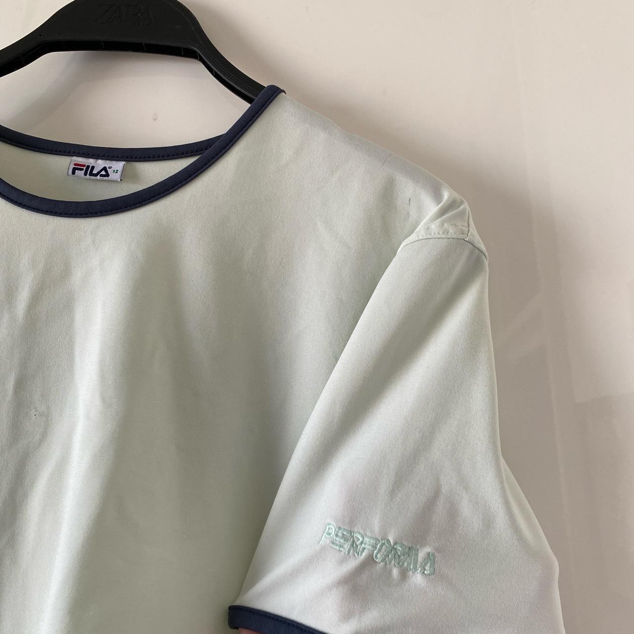 Fila mint green / light blue lycra sports top with... - Depop