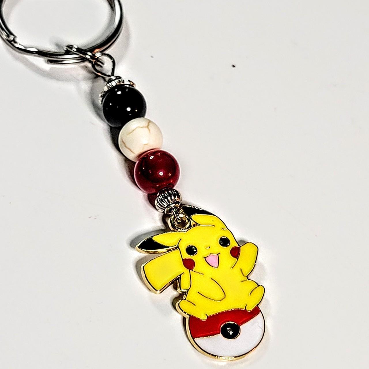 Pikachu on Pokémon ball with red Agate, black... - Depop
