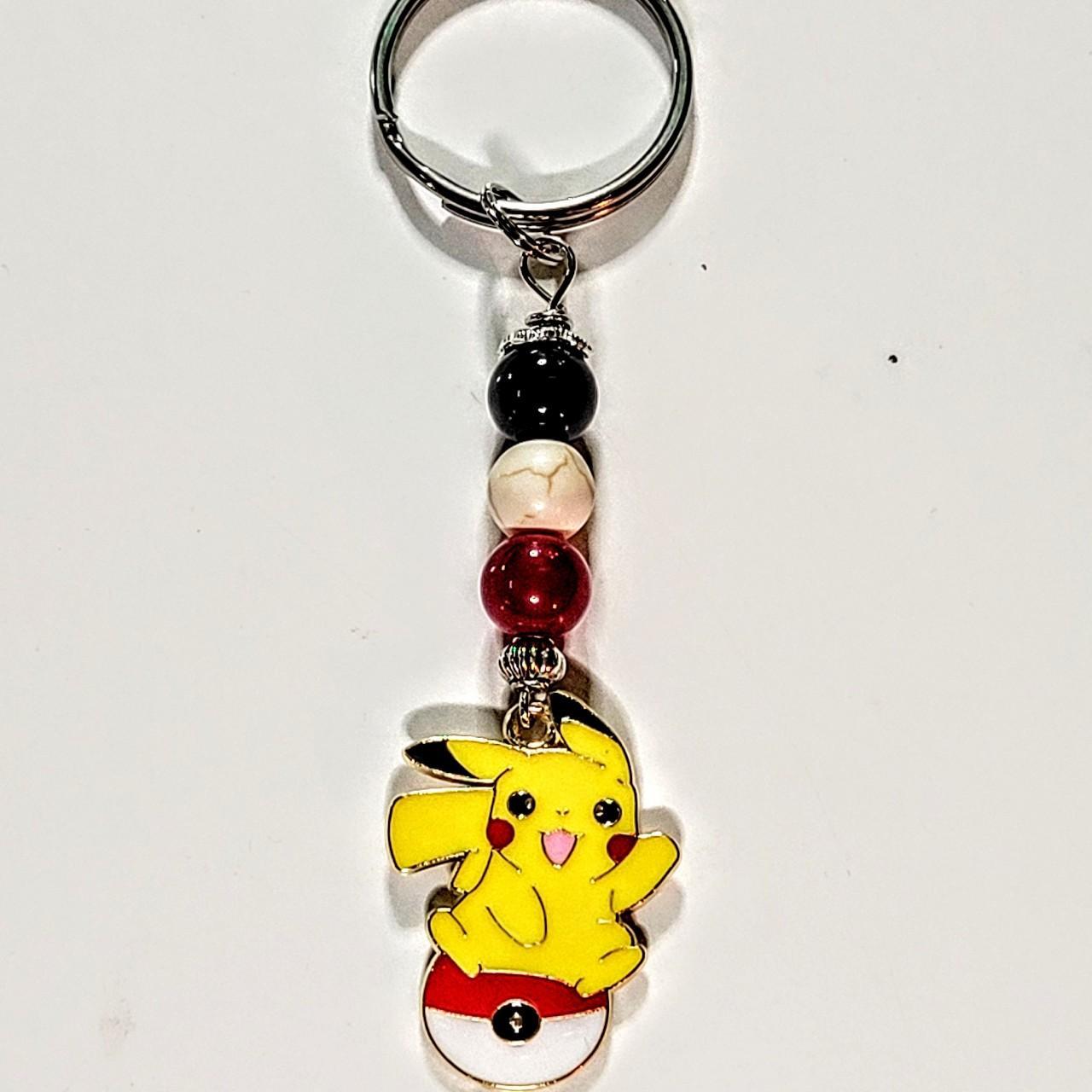 Pikachu on Pokémon ball with red Agate, black... - Depop