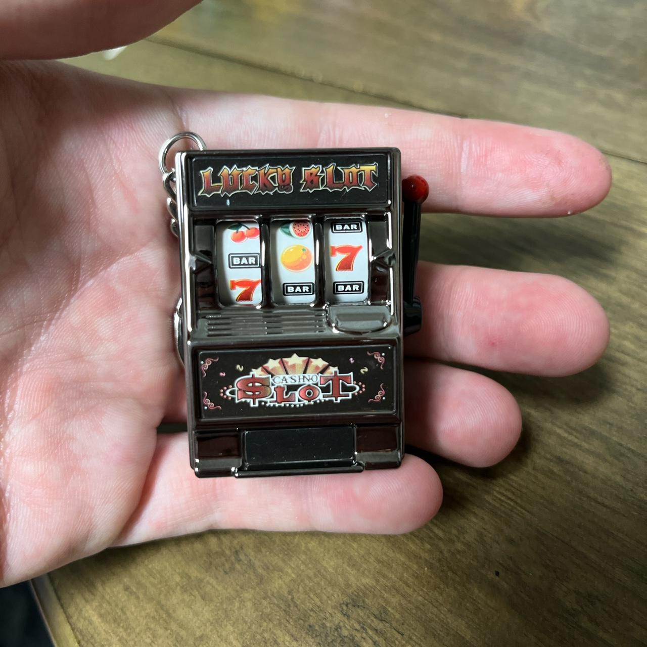Black and red slot machine keychain... - Depop