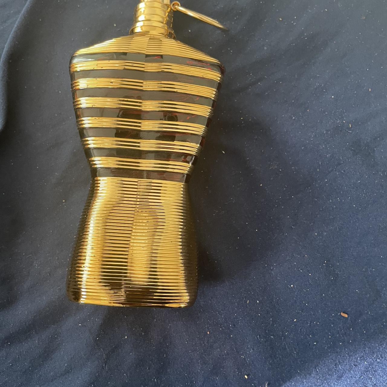 Jean Paul Gaultier gold and black body fragrance bottle | Depop