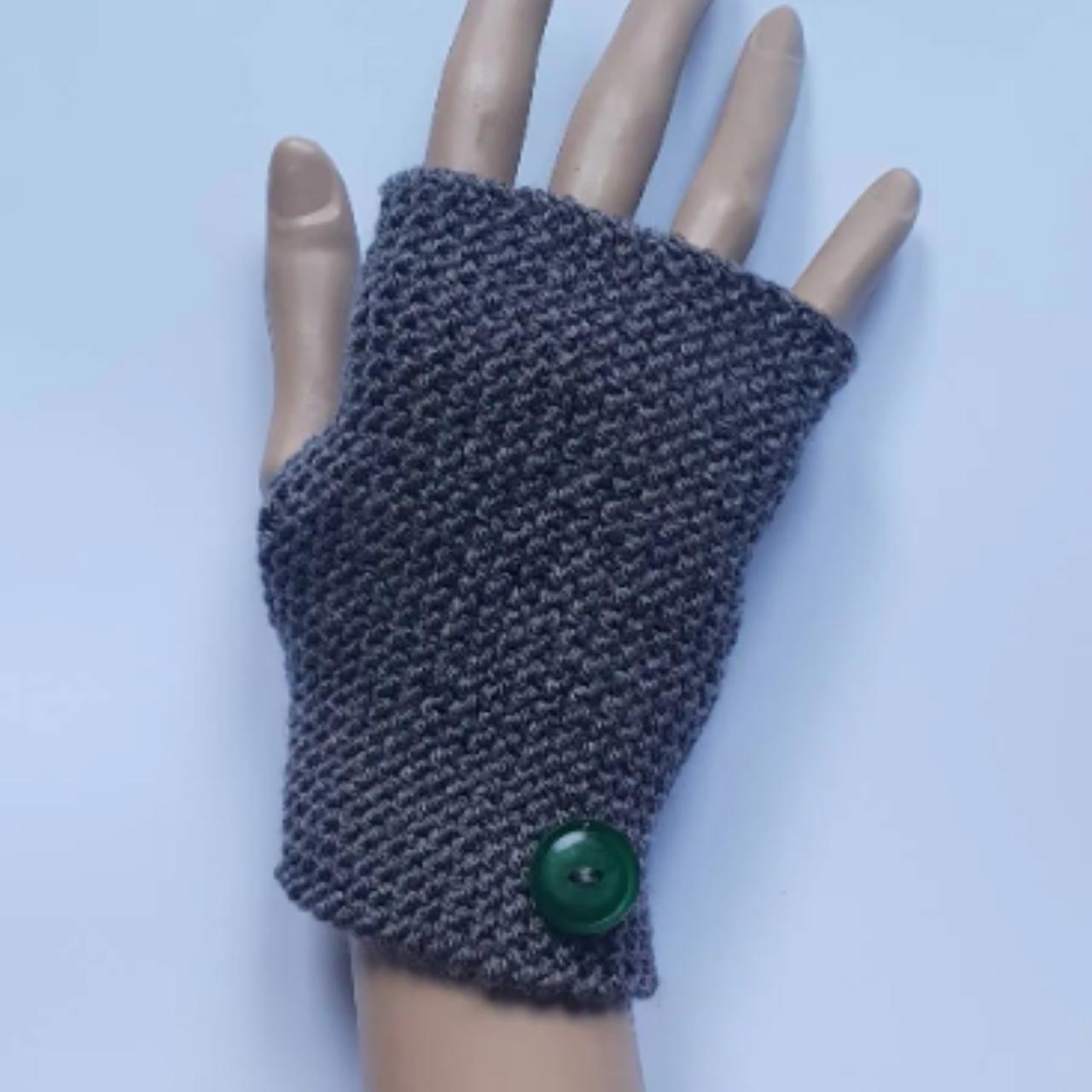 Grey fingerless gloves with green button... - Depop