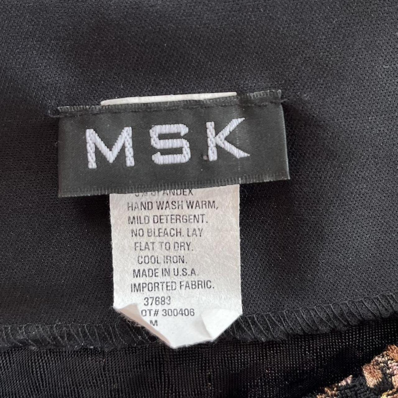 Black with white striped detail, MSK tank... - Depop