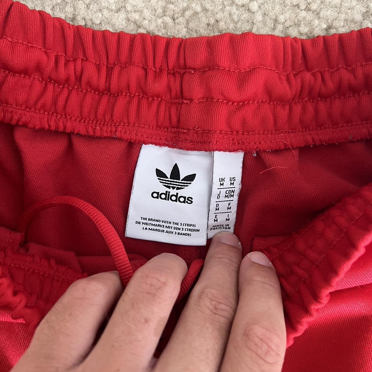 Red adidas tracksuit pants - Depop