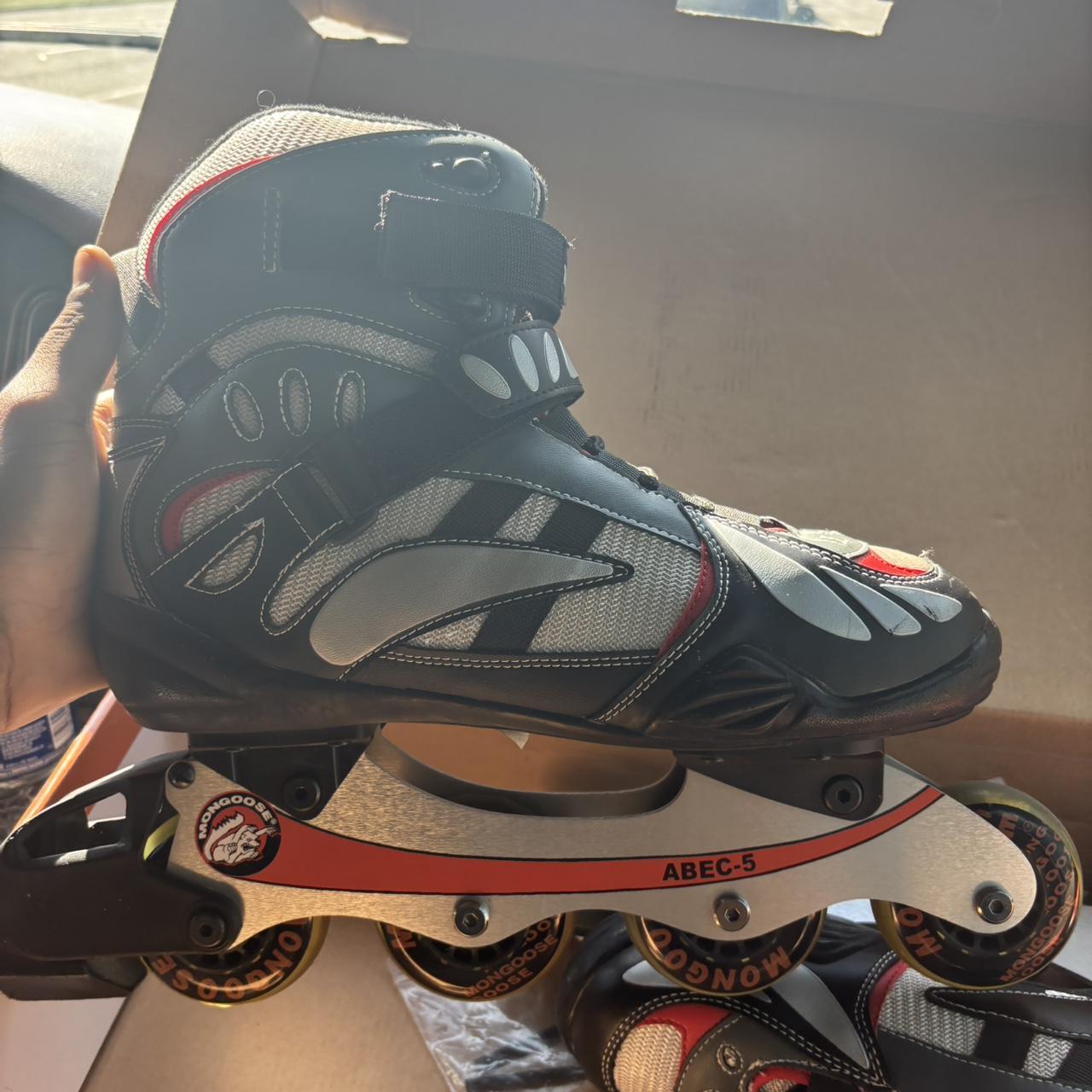 Mongoose black and red rollerblades... - Depop