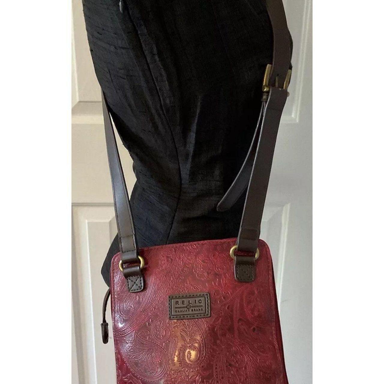 This Relic crossbody purse features a vibrant red... - Depop