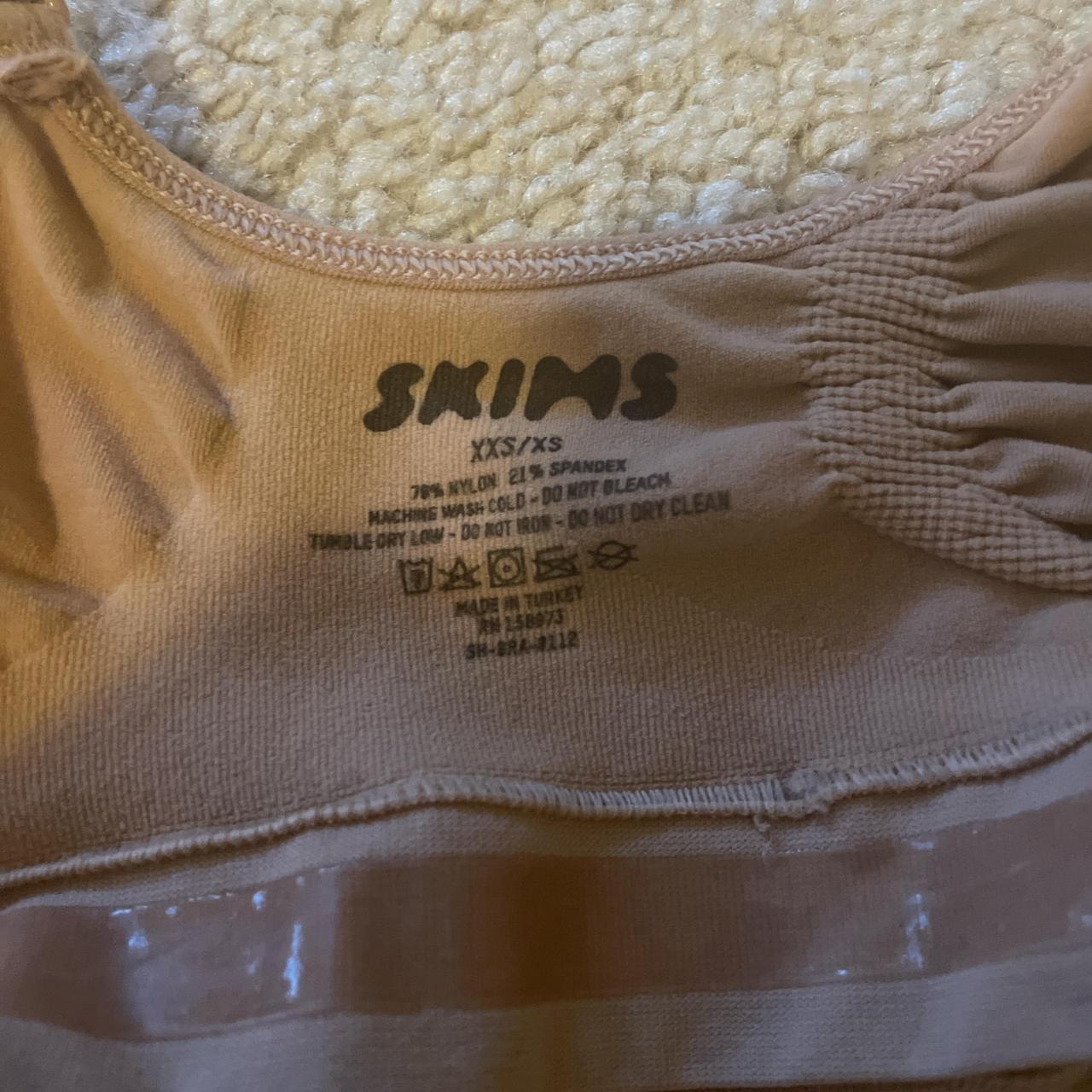 Skims xs bra it’s really stretchy so it’s way bigger... - Depop
