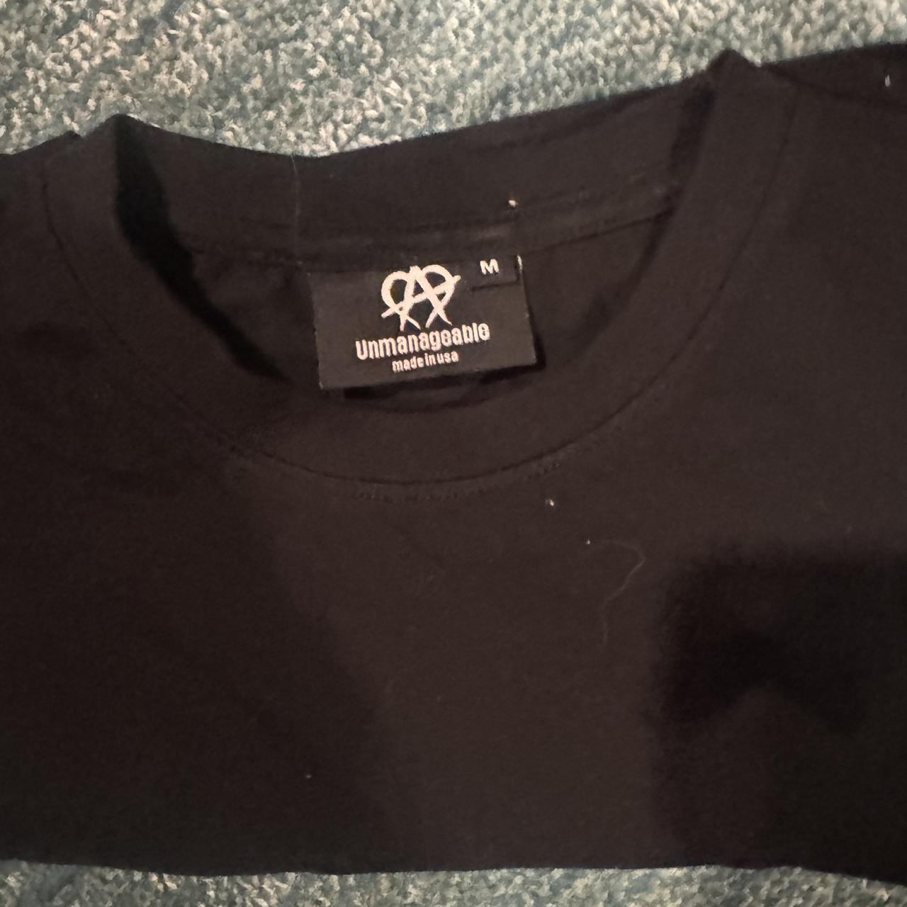 Black and reflective Unmanageable Anarchy logo... | Depop