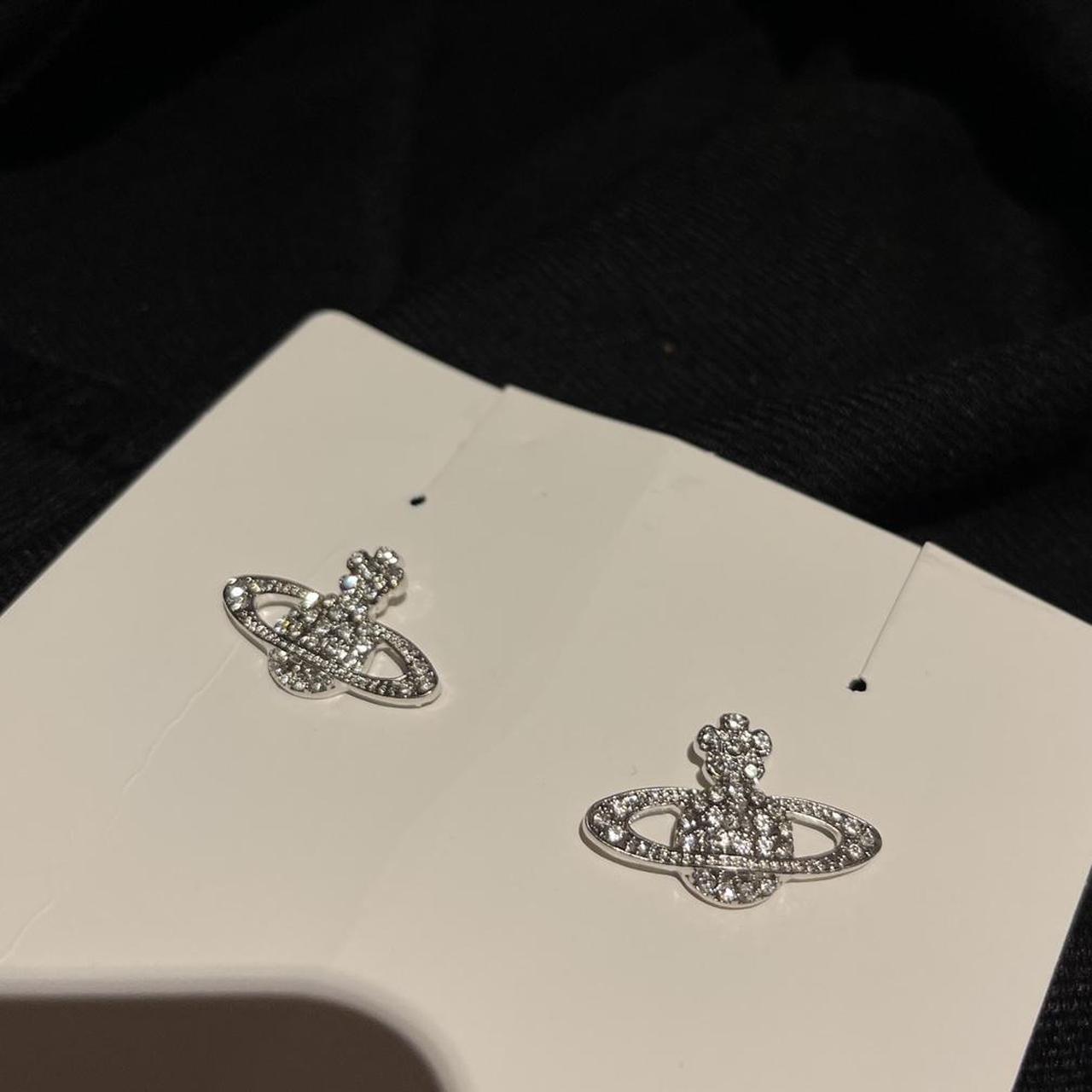 Silver rhinestone planet stud earrings and necklace... | Depop