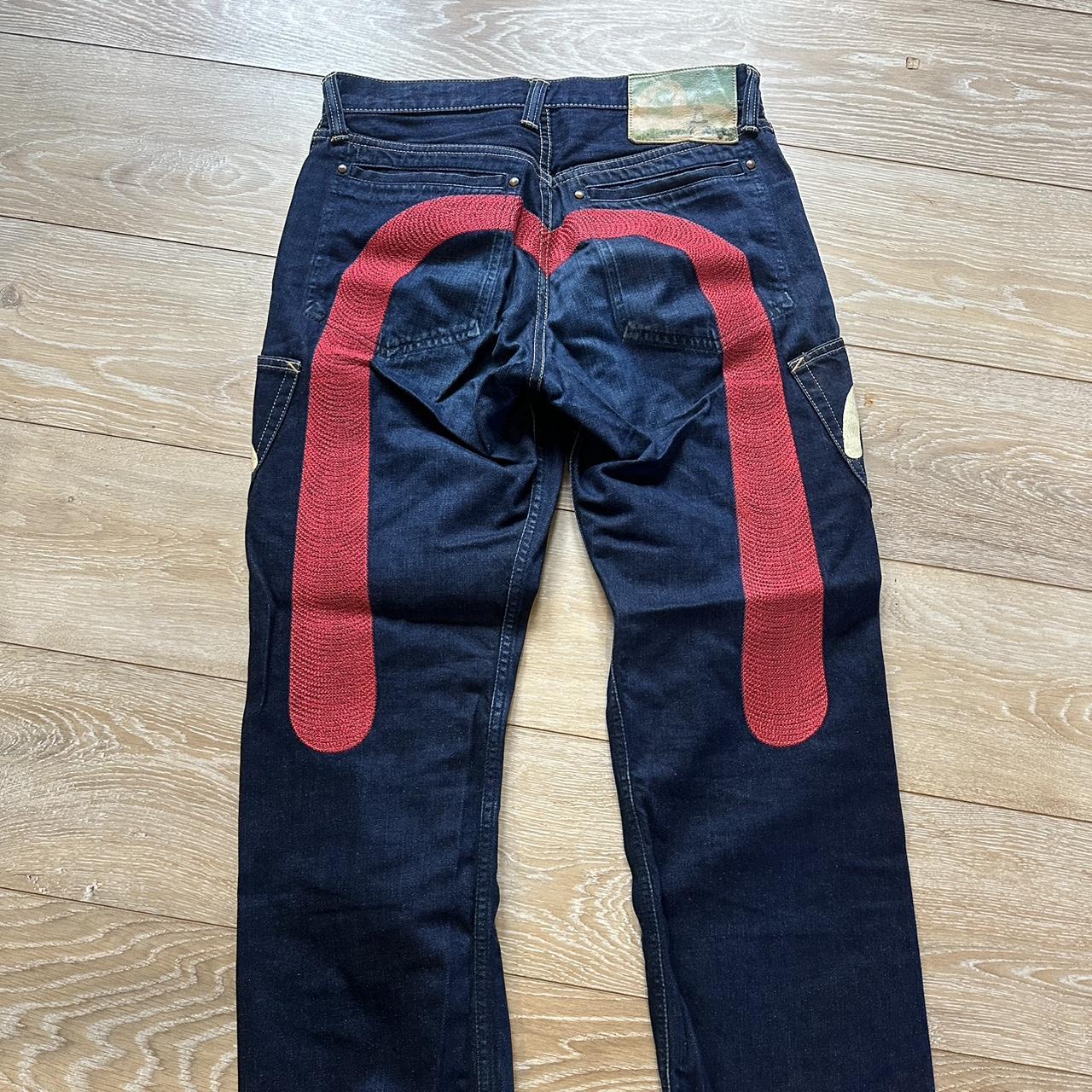 Evisu daicock denim jeans with red & yellow... - Depop