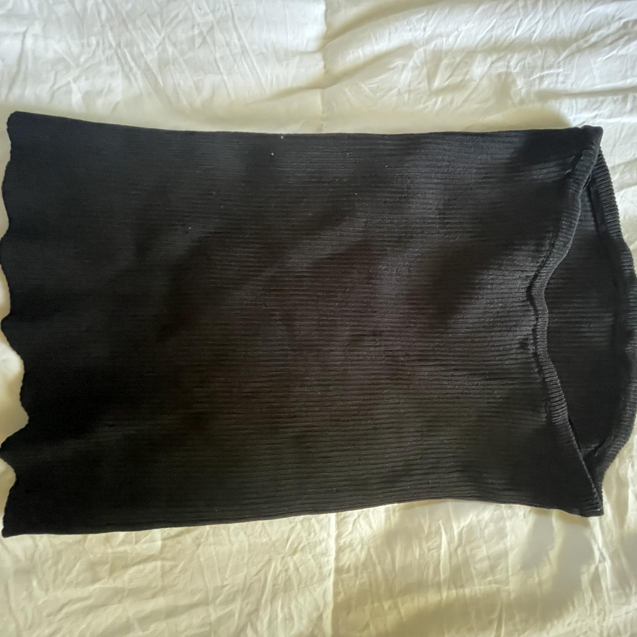 black ribbed tube top. photo has some glare, very... - Depop